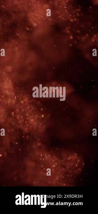 A multitude of small sand particles is suspended in the air. The ...