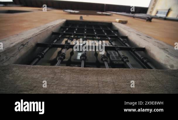Old window with grill in stone house historical architecture in Bergamo ...