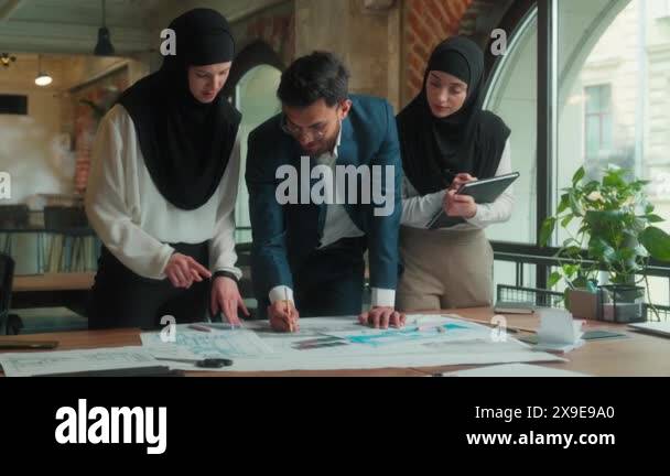 Arabian man muslim women in hijab business team colleagues architect ...