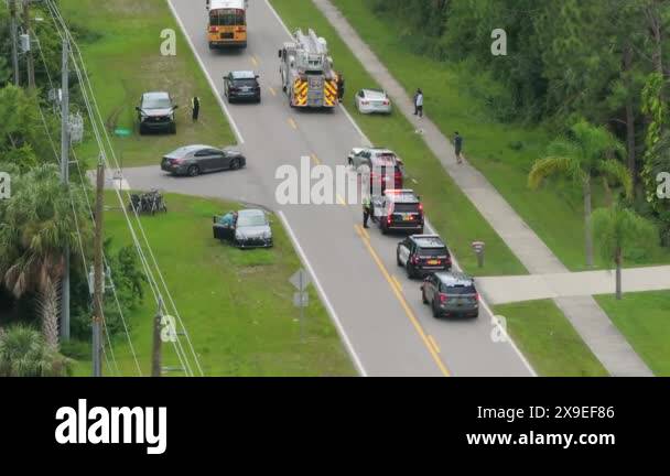 First responders responding to car accident site on American street in ...
