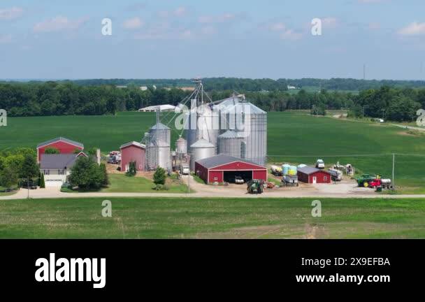 Typical American farm with commercial grain storage bins in rural ...