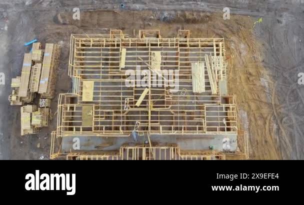 Wooden construction frame of new condo building under development ...