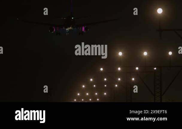 Frontal view of an aircraft with landing gear and undercarriage lights ...