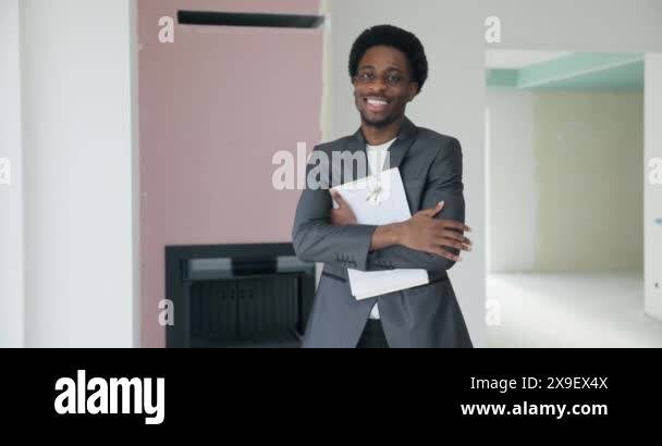 African real estate agent exudes enthusiasm proudly showcases the ...