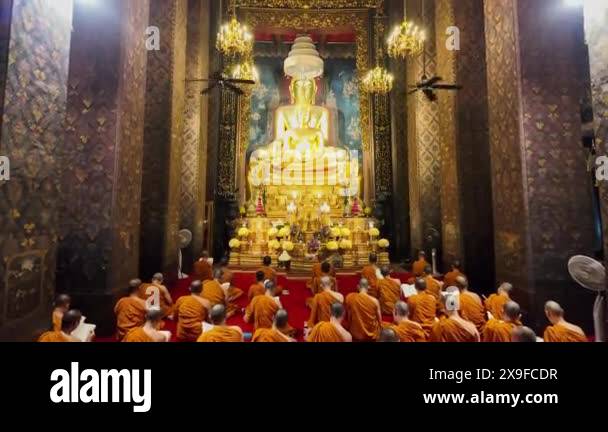 Bangkok, Thailand - April 10, 2024: Monks join in chanting prayers in ...