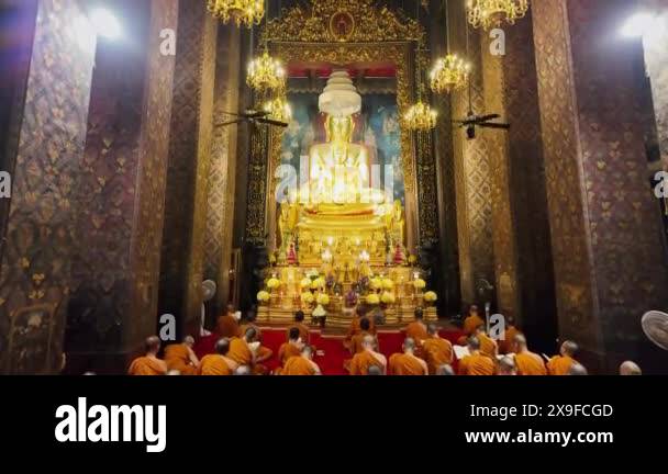 Bangkok, Thailand - April 10, 2024: Monks join in chanting prayers in ...