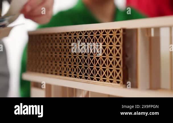 Slow motion home designer using architectural equipment draw a ...