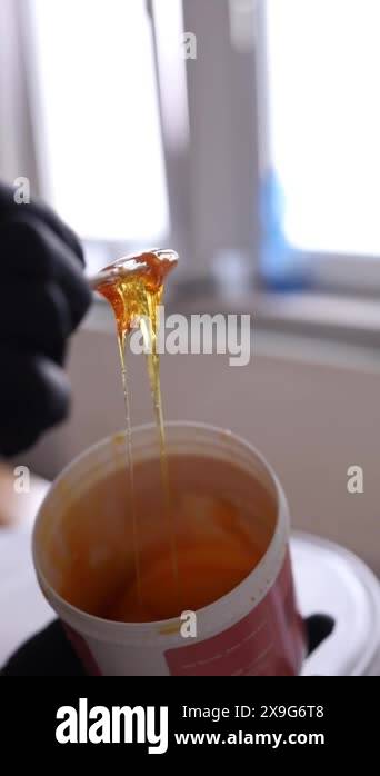 Sugar paste for depilation, liquid and dripping. High quality FullHD ...