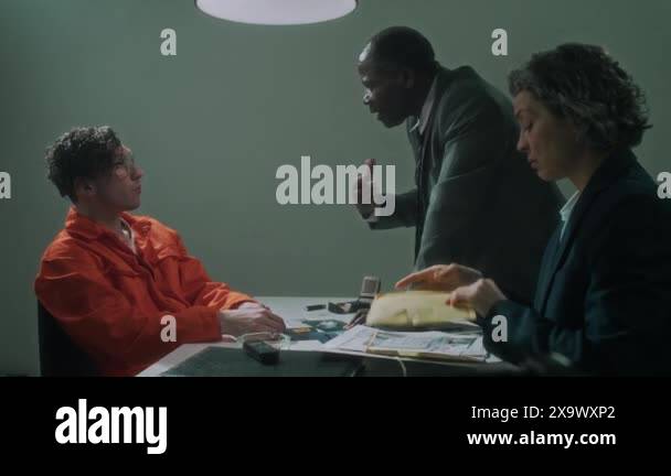 Medium shot of multiethnic male and female federal agents questioning ...