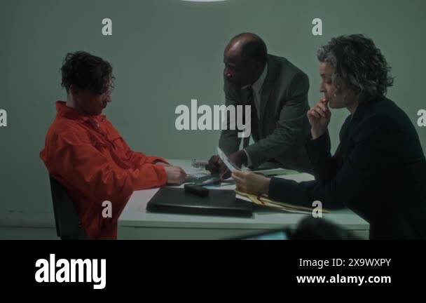 Medium side shot of angry African American federal agent shouting at ...