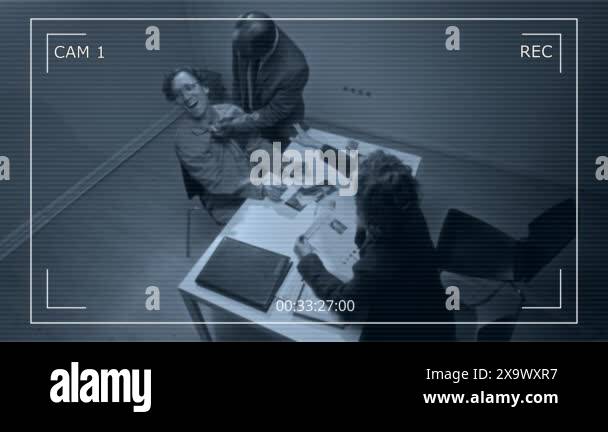 Full surveillance camera top shot of diverse officers interrogating ...