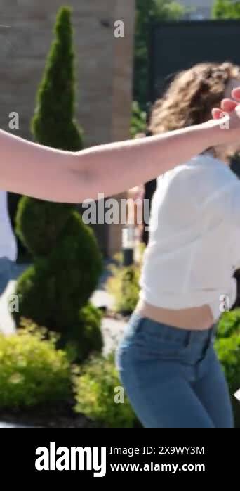 High school graduates dancing waltz and classical ball dance in dresses ...