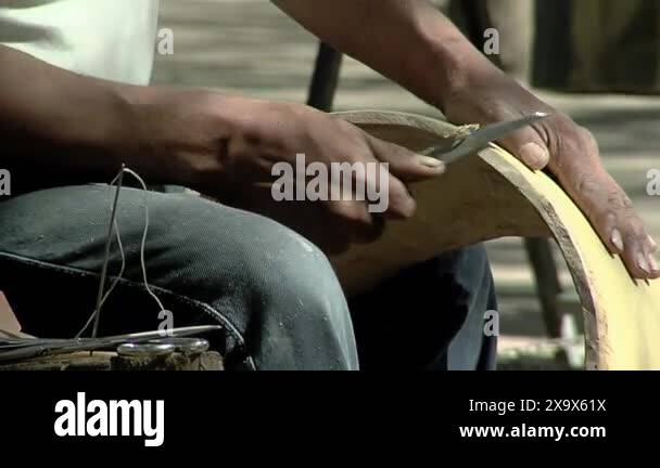 Drum Maker Making a "Bombo Leguero", an Argentine Drum made with Wood ...