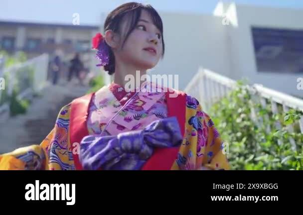 A young woman in her twenties, wearing traditional Ryusou, navigates ...