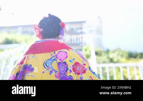 A young woman in her twenties, wearing traditional Ryusou, navigates ...