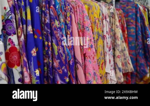 A beautifully arranged closet filled with traditional Ryusou attire in ...