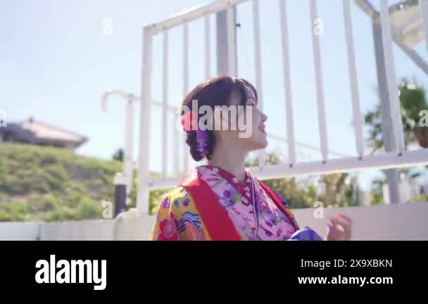 A young woman in her twenties, wearing traditional Ryusou, navigates ...