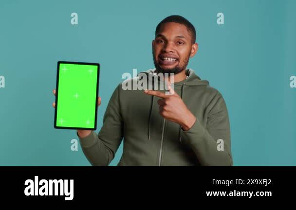 Joyous african american man holding isolated screen laptop, doing ...