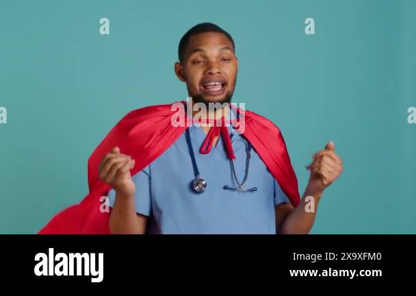 Male nurse portraying superhero showing courage and strength fighting ...