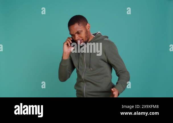Irked african american man fighting with friends during telephone call ...