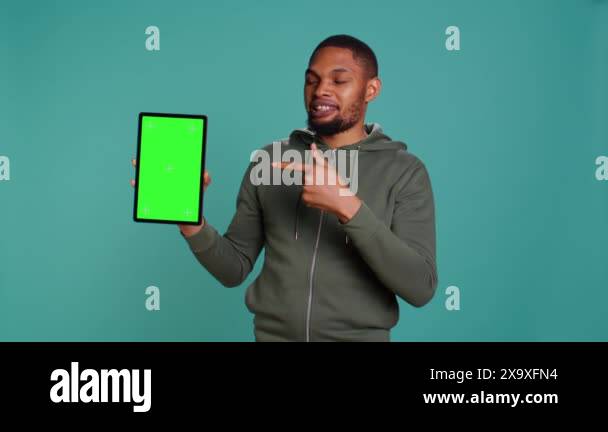 Joyous african american man holding isolated screen laptop, doing ...