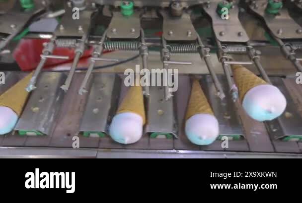 Ice cream on the conveyor line. Ice cream cone on the conveyor ...