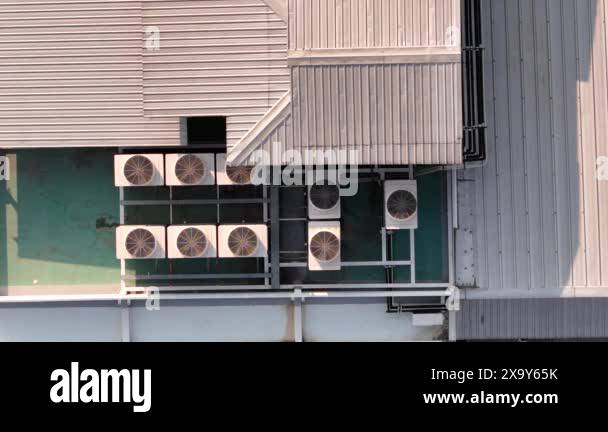 Air conditioner compressor installed in old building. Outdoor split ...