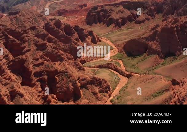 A view from the height of the dried riverbed in the canyons of Konorchek. Canyons have been ...