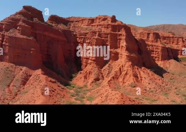 Rocky columns of red sandstone. The Konorchek canyons have been created ...