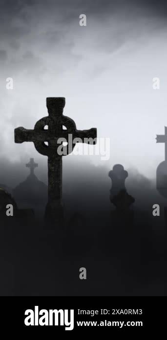 Vertical Skeleton Walking Through a Misty Graveyard 4K Loop features a ...