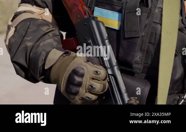 Soldier hand charging rifle. Assault rifle charging. Close up of ...