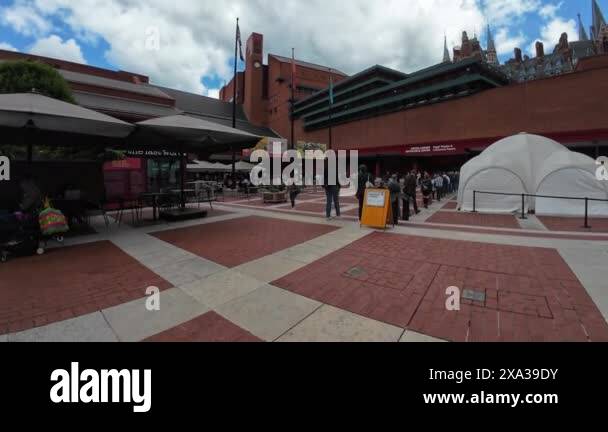 London. UK- 05.29.2024. Walking along the front courtyard of the ...