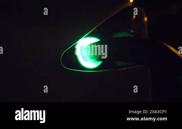 Electric car charging at night time. Power connector inserted into EV ...