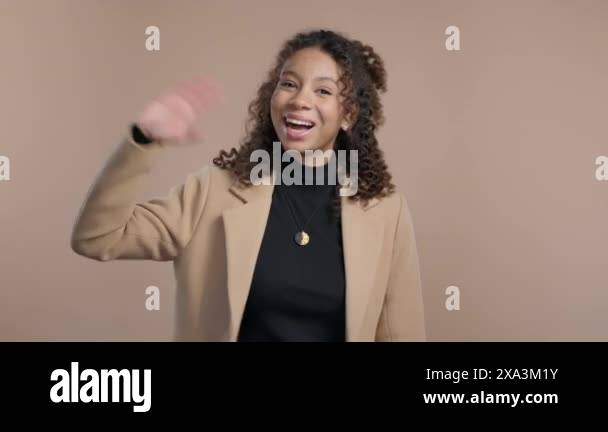 Friendly young teenager girl waving hand - hello, or goodbye, chao ...
