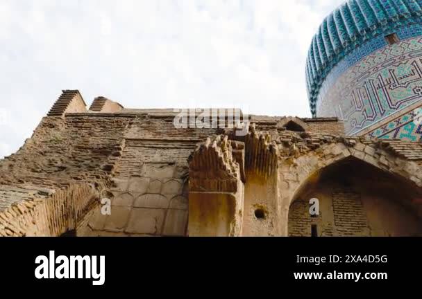 Gur Emir mausoleum exterior with dome and old brick wall of the Asian ...