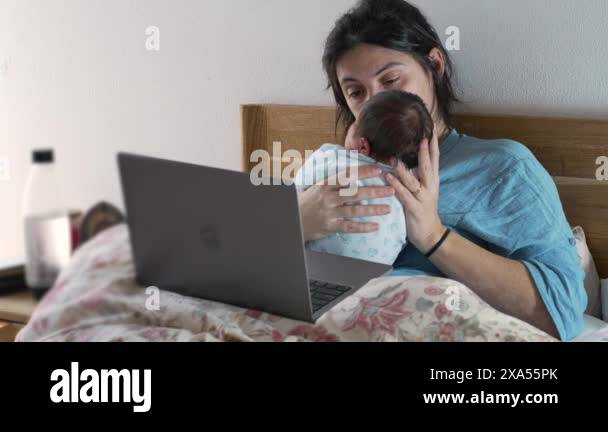 Mother smelling baby's diapers to check for poop while multitasking ...