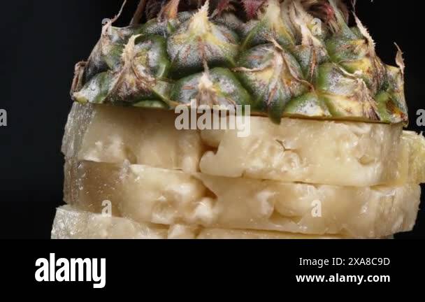 Close up video of fresh pineapple with slice of peel pineapple insert ...