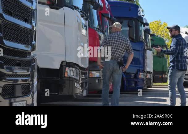 May 15, 2024. Krakow, Poland. Truck Drivers Discussing Logistics at a ...