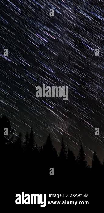 Time lapse of Star trails in the night sky. Stars move around a polar ...