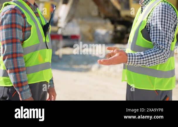Two men workers shaking hands at quarry. Team of male specialists ...