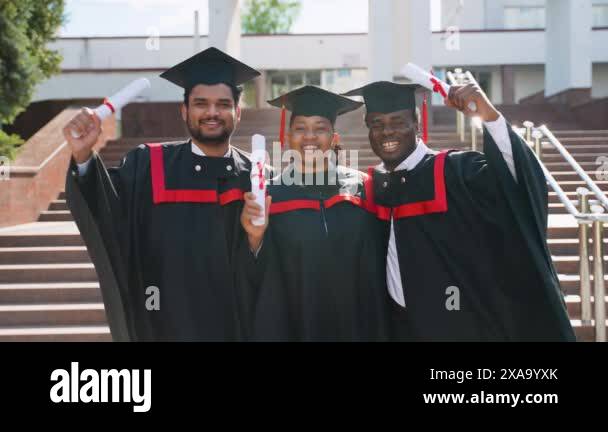 Happy african american group of students graduates in graduation gowns ...
