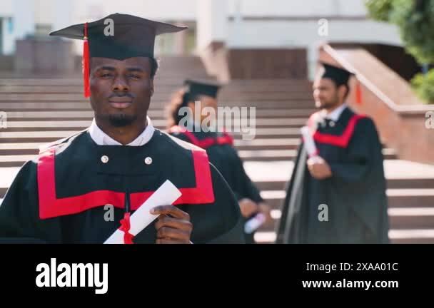 African american student on his graduation day in university campus ...