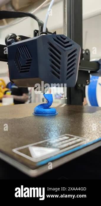 Process of printing object on 3D printer from molten plastic. 3D printer printing model using ...