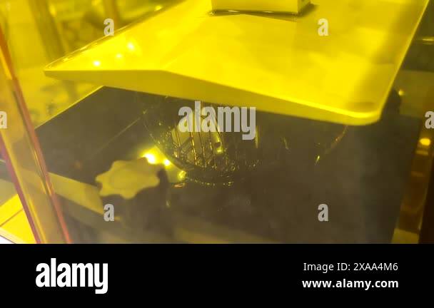 3D printer working process. 3D printing. Stereolithography photopolymerization SLA. Additive ...