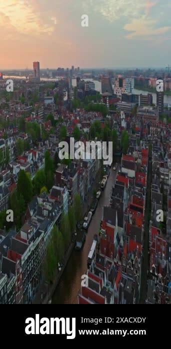 Amsterdam city of Netherlands. Aerial view of canals with electric ...