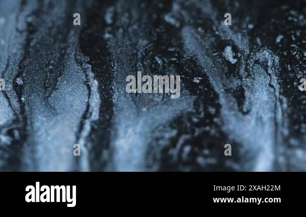 Sparkling ink wave. Paint mix layers. Blur black silver color metallic ...