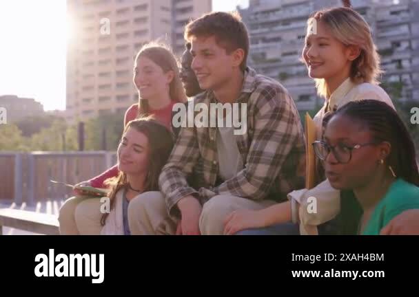 Young student colleague standing smiling and posing for photo looking at camera with her ...