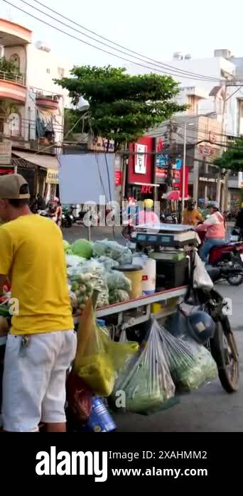 a poor man sells with a cart greens various green herbs onions cilantro ...
