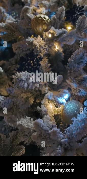 Dolly shot from Christmas tree top to presents boxes. Big blue present ...