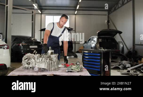 Auto Mechanic Repairing Car Engine in Workshop. Auto mechanic working ...